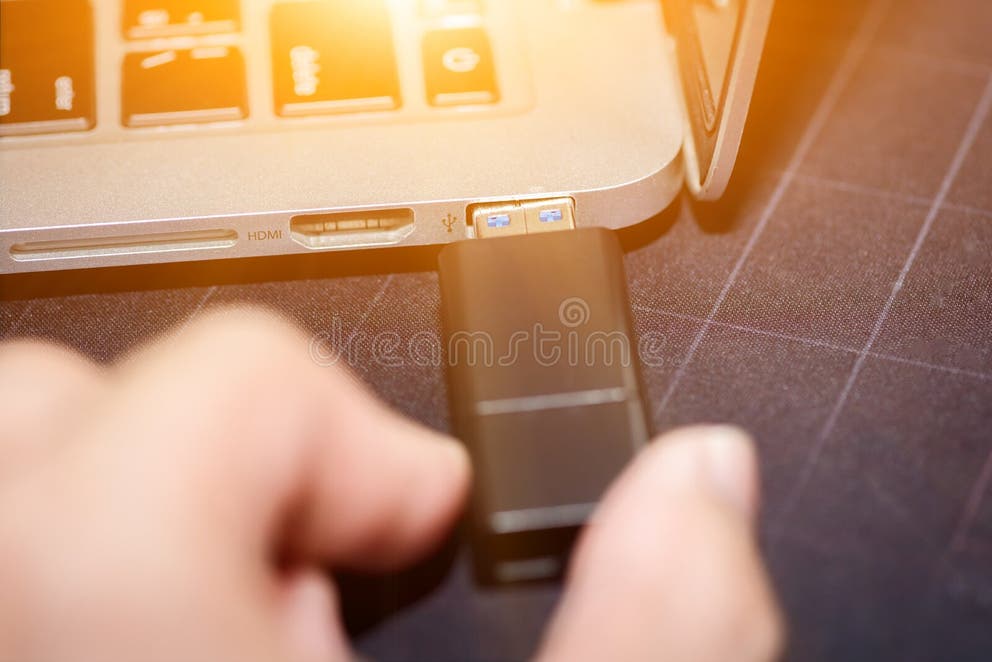 Hand Inserting USB Flash Memory Drive Plugged into a Computer Laptop ...