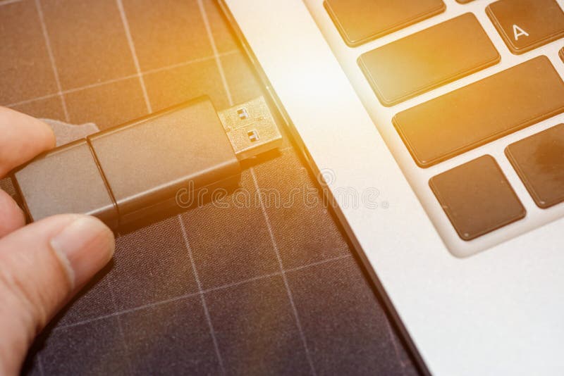 Hand Inserting USB Flash Memory Drive Plugged into a Computer Laptop ... Hand Inserting USB Flash Memory Drive Plugged into a Computer Laptop ...