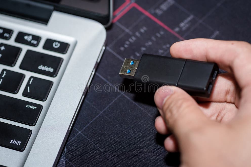 Hand Inserting USB Flash Memory Drive Plugged into a Computer Laptop ...