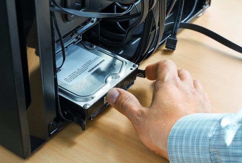 Hand Inserts Hard Disk Memory into System Unit of Computer Stock Image ...