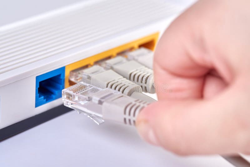 The Hand Inserts the Internet Cable into the Router Stock Photo - Image ...