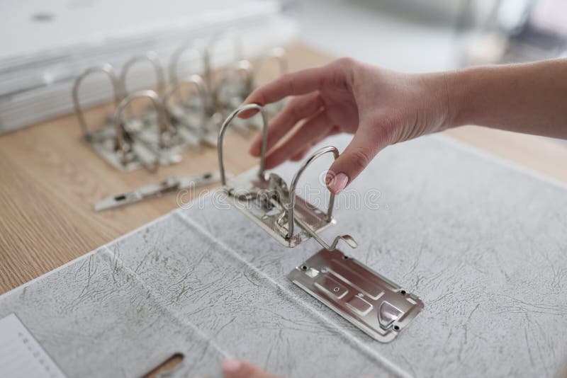 The Hand Inserts the Ring Mechanism into the Folder Stock Image - Image ...