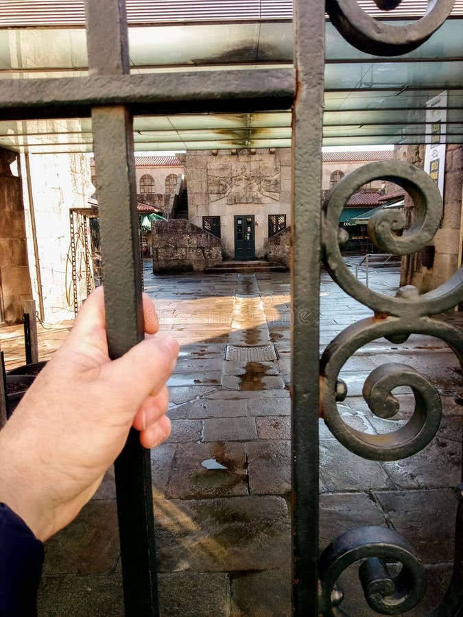 Hand on the iron gate stock photo. Image of gate, fence - 255300750