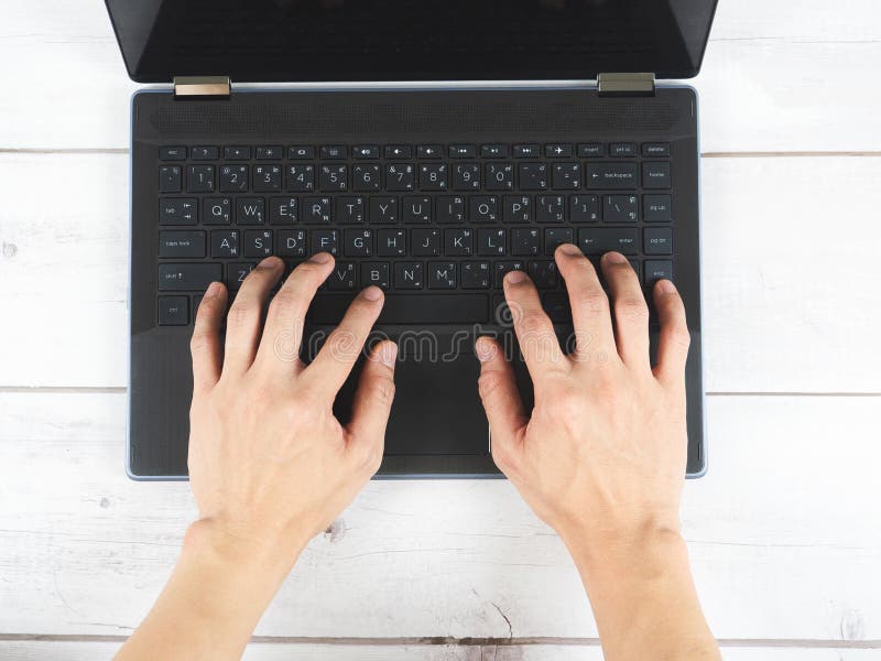 Hand on Keypad of Laptop on the Wood Table Stock Image - Image of ...