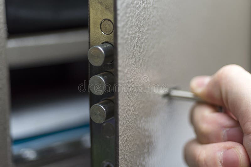 The Hand with the Keys Opens the Safe Deposit Box. Stock Image - Image ...