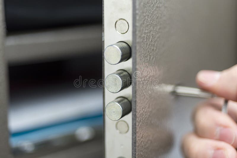 The Hand with the Keys Opens the Safe Deposit Box. Stock Image - Image ...