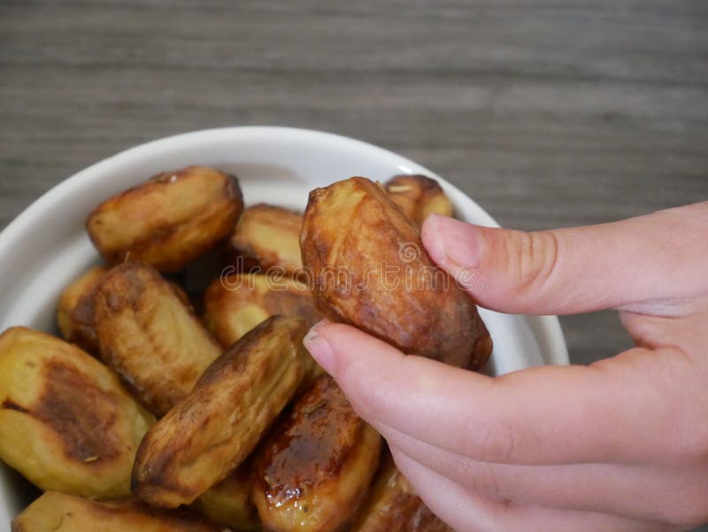 Hand of a Kid that Pick Potatoes Roasted Stock Image - Image of baking ...