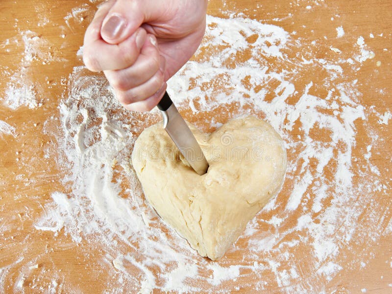 Hand with Knife Struck Heart of Dough Stock Photo - Image of bake ...