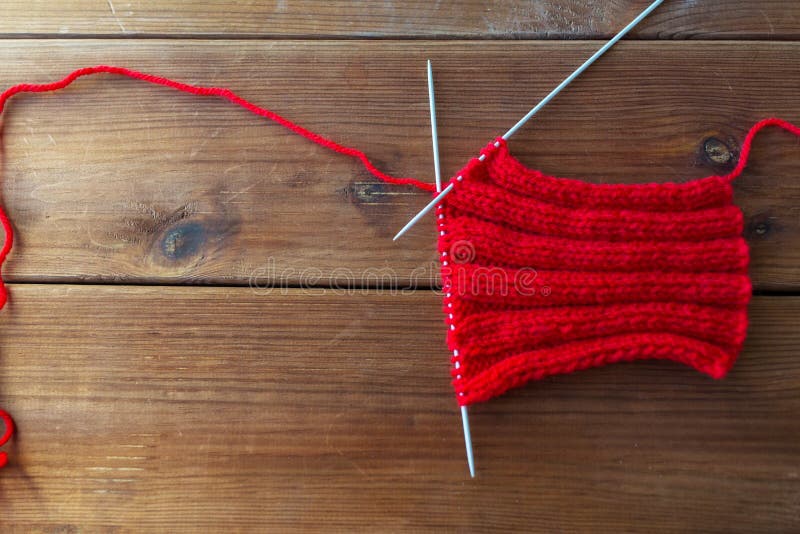 Hand-knitted Item with Knitting Needles on Wood Stock Image - Image of ...