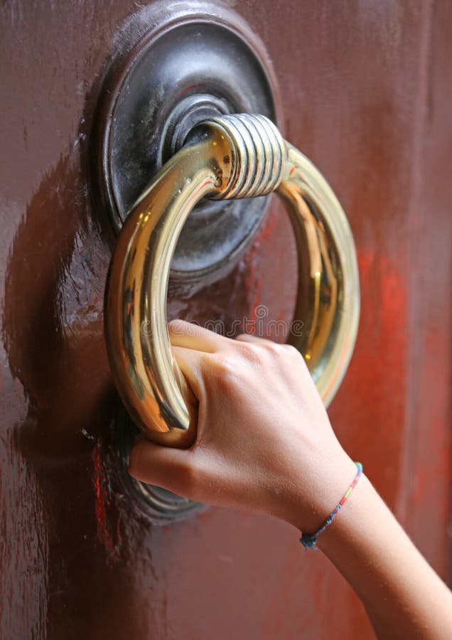 Door with knocking hand stock image. Image of ring, copper - 1468663