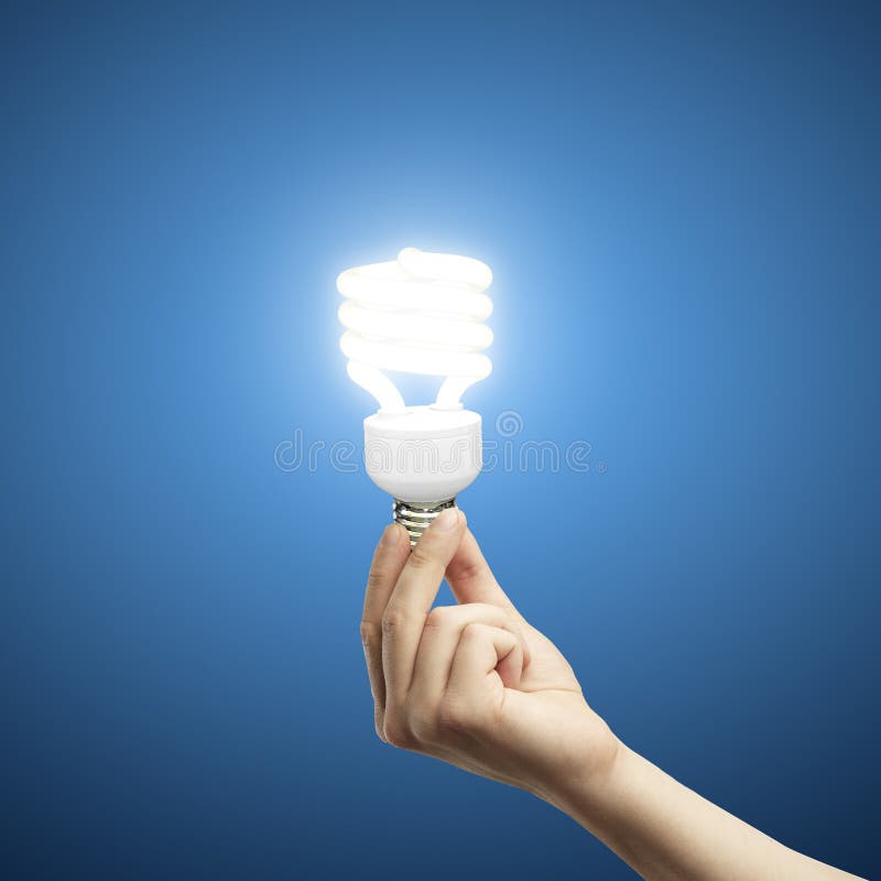Hand holding light bulb stock image. Image of electricity - 3984625