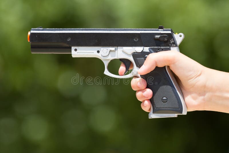 Hand with a laser gun stock photo. Image of shot, weapon - 77246020