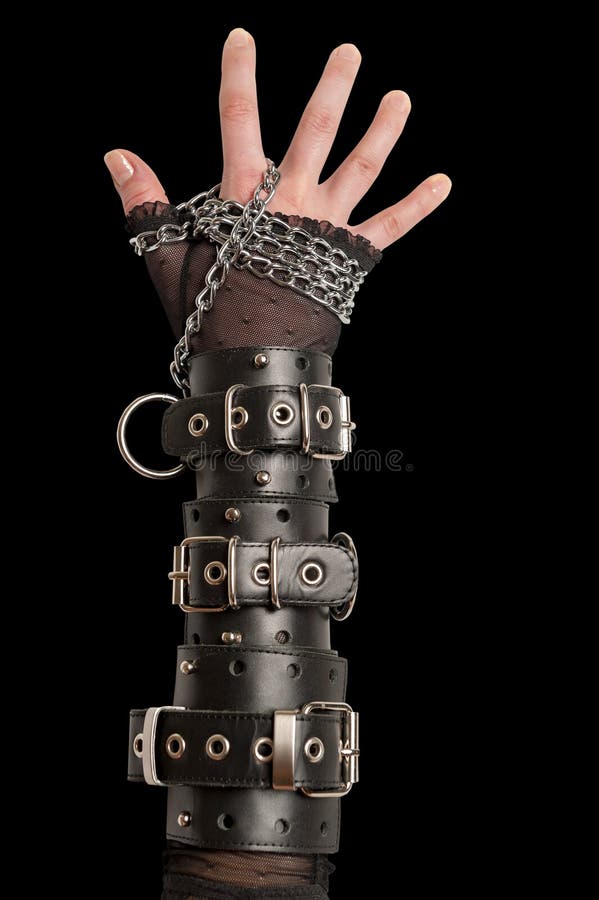 Hand in Leather Cuffs on Black Stock Image - Image of cuffs, gothic ...
