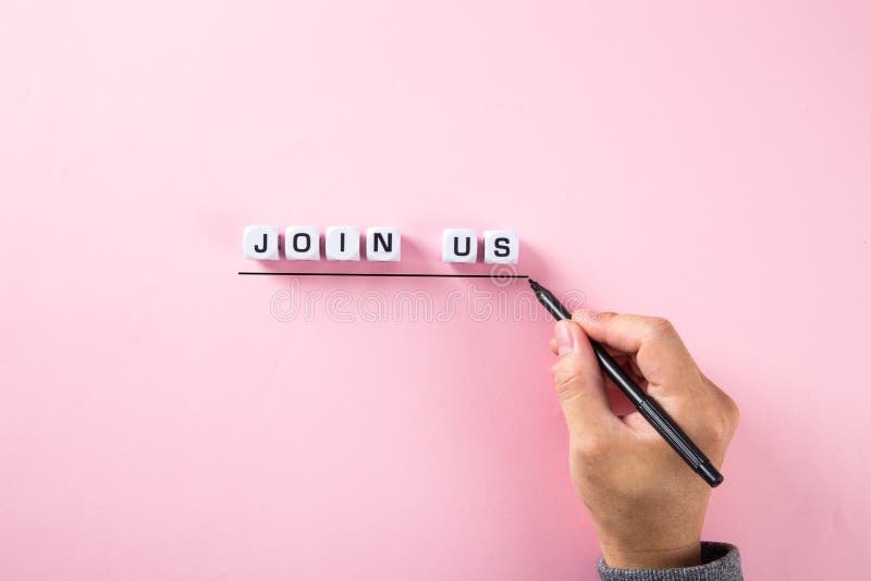 Hand with Lettering Join Us on Pink Background Top View Stock Photo ...