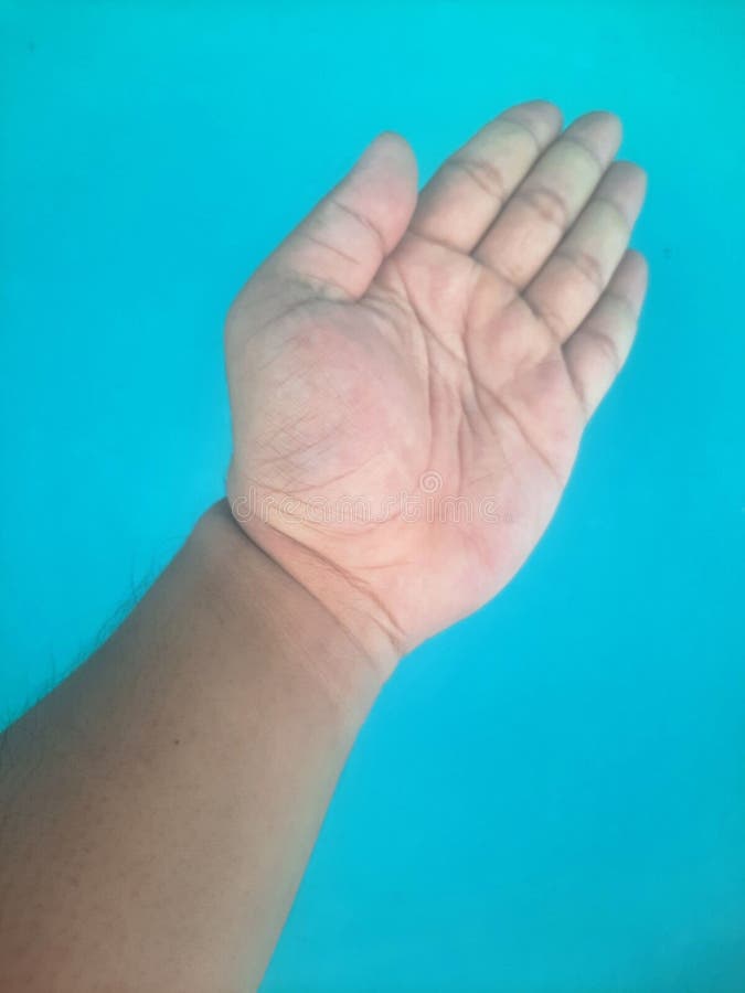 A Hand on a Light Blue Background Stock Photo - Image of design, grab ...