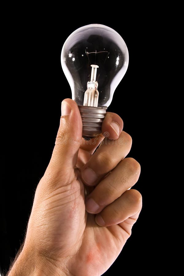 Light bulb on hand stock photo. Image of human, design - 13265556