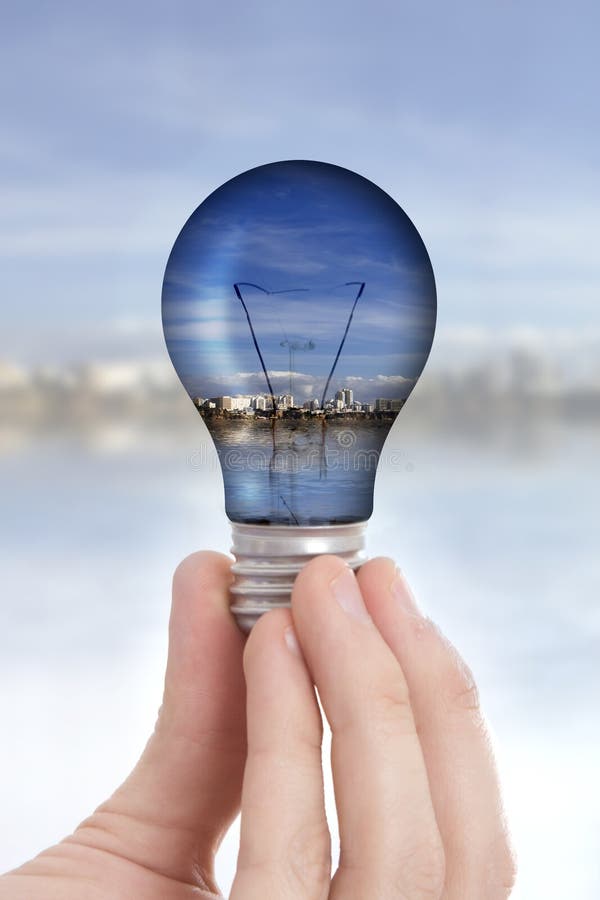 Hand with light bulb stock image. Image of environment - 13265627
