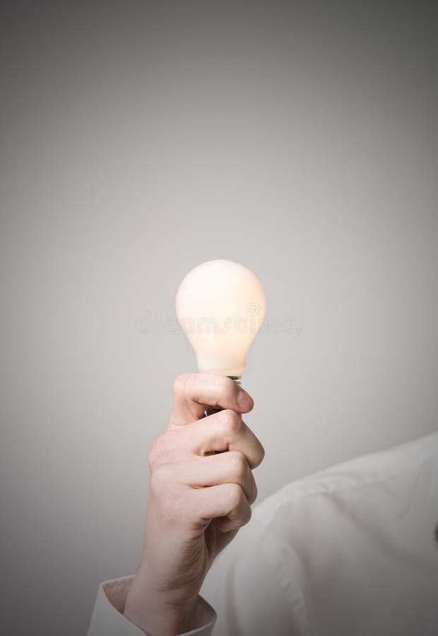 Hand with light bulb stock photo. Image of gleam, studio - 9069740