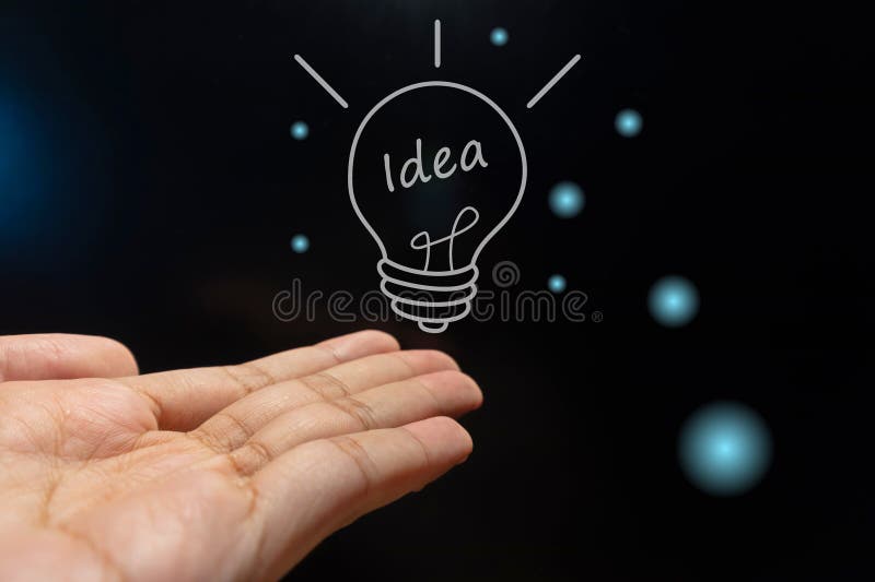 Hand with Light Bulb. Business Idea Concept with Innovative Technology ...