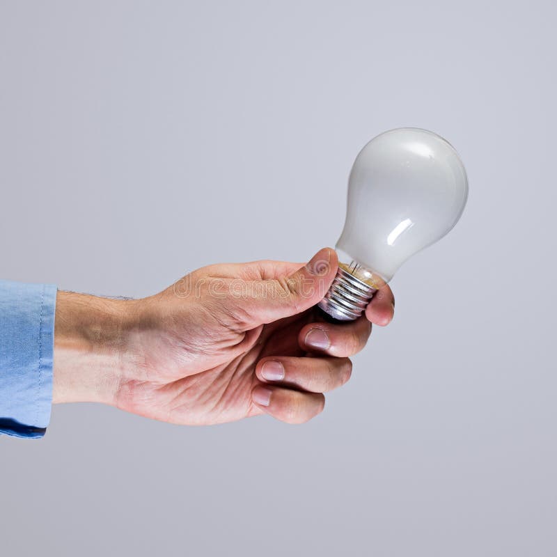 Hand with light bulb stock image. Image of save, lamp - 56369381
