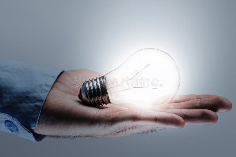 Hand with light bulb stock photo. Image of electric, efficiency - 56372672