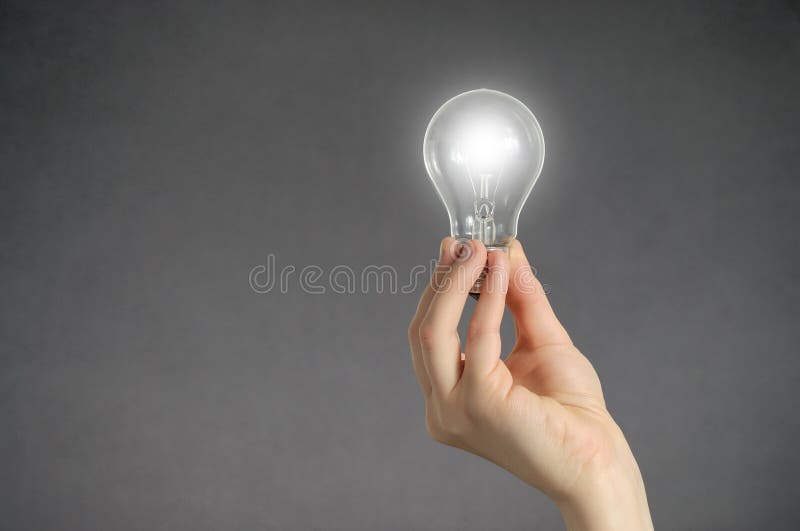 Hand with light bulb stock photo. Image of ecology, industry - 29992562