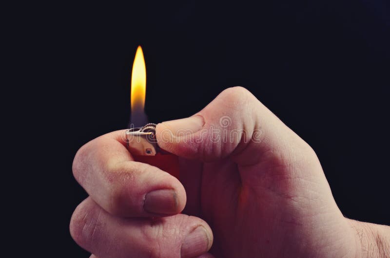 The hand with the lighter stock image. Image of dark - 87888119