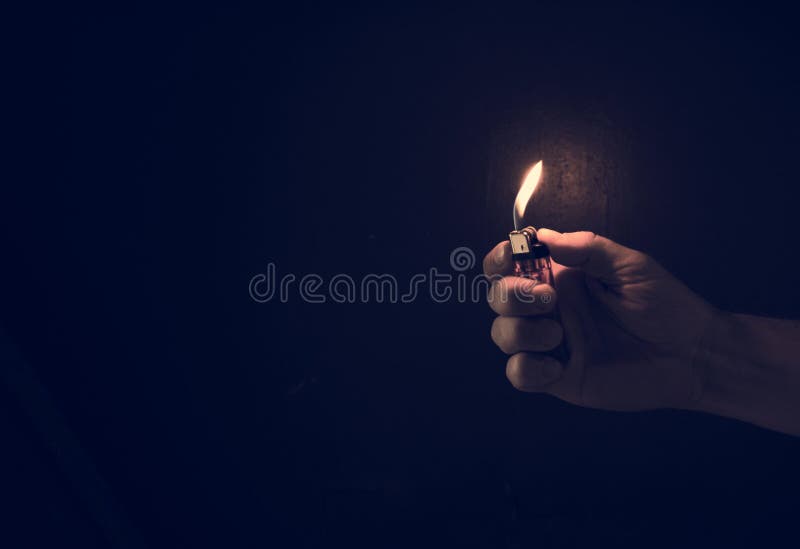 Lighting Up the Lighter stock photo. Image of fire, design - 71579096