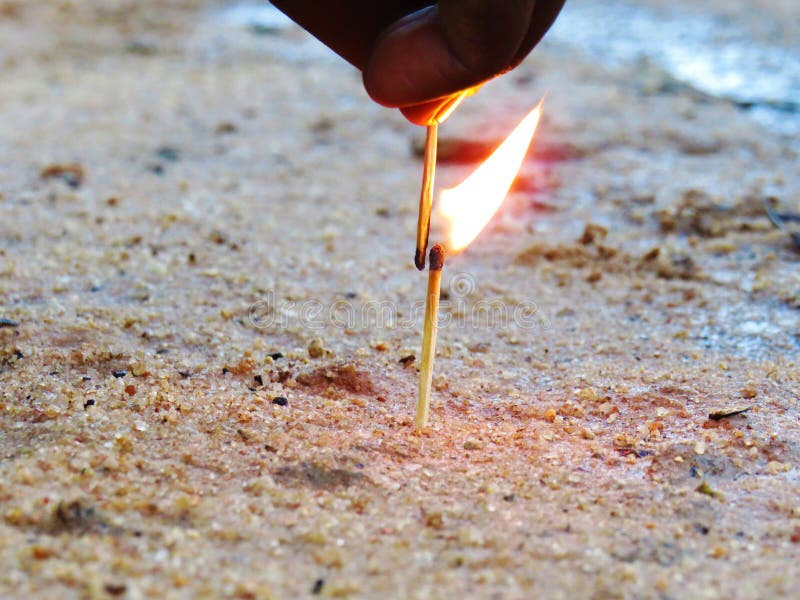 Lighting a Match Against a Black Background Stock Photo - Image of fire ...