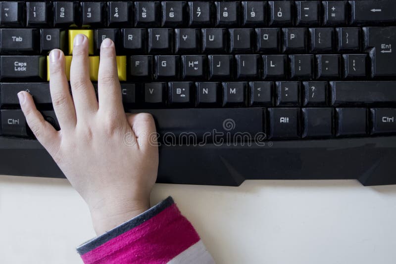 Hand of a Little Child with Computer Keyboard.Little Asian Boy Using ...