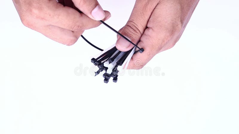 Hand Locking Cable Tie on Isolated Stock Video - Video of secure, craft ...