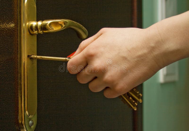 Hand Holding Key Opening Door Lock Stock Image - Image of keyhole ...