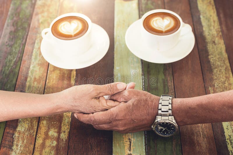 Hand Love of Ole Couple in Coffee Shop Stock Photo - Image of ...