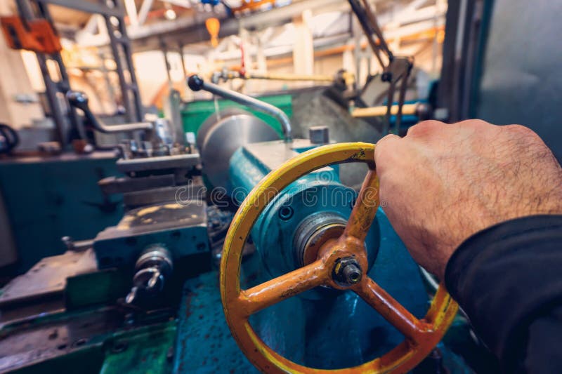 The Hand of the Machine Operator Creates a Mechanical Switch on the ...