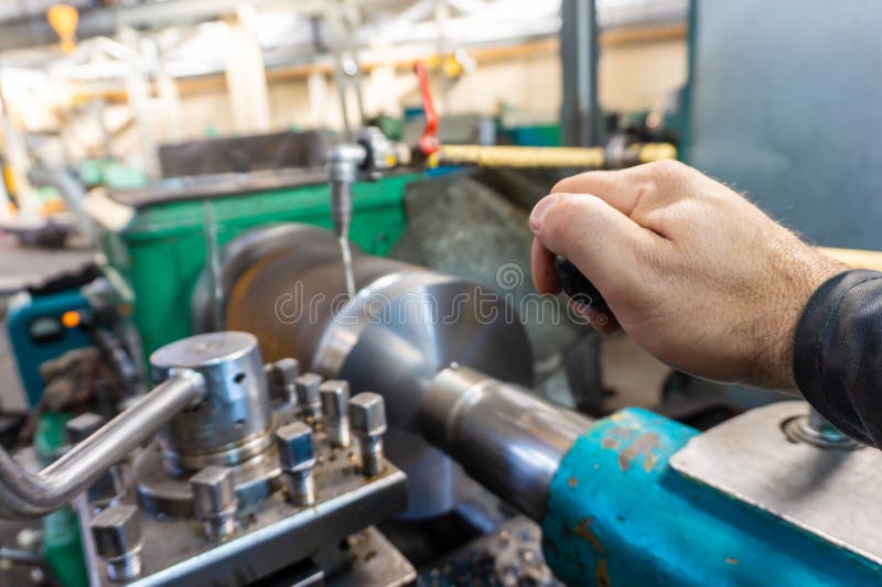 The Hand of the Machine Operator Creates a Mechanical Switch on the ...