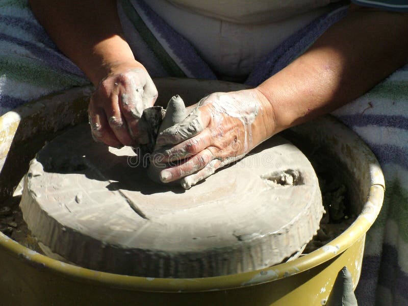 Hand made stock image. Image of spiningwheel, clay, fair - 112305