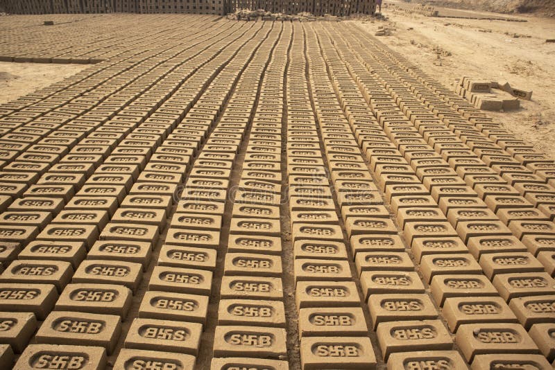 Hand Made Bricks from Wet Clay and Mud are Kept for Drying before the ...