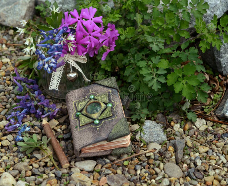 Hand Made Witch Diary with Bunch of Primrose in the Garden Stock Photo ...