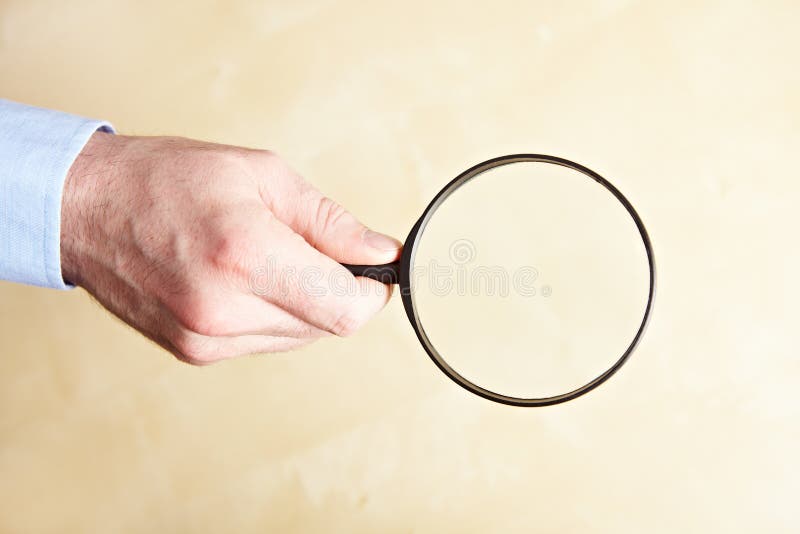 Hand with magnifying glass stock image. Image of space - 179740651