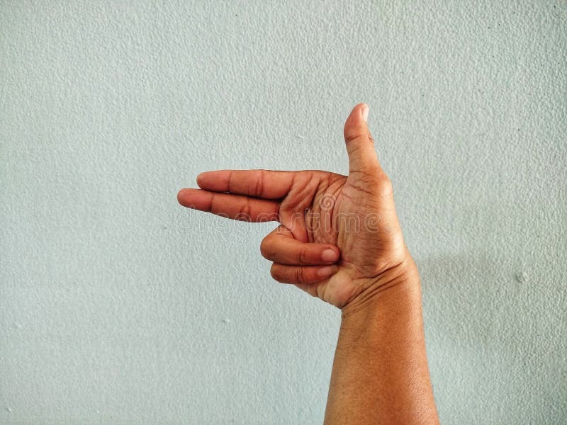 A Hand Makes a Gesture Resembling a Gun, Stock Photo - Image of person ...