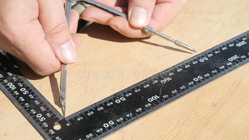 The Hand Makes a Measurement of the Compass with a Ruler Stock Video ...