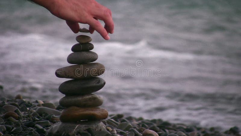 Hand Making Pyramid Pebble on Stock Video - Video of stability, serene ...