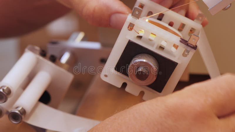 Hand Making a Transformer Using Coil Winding Machine - Close Up Stock ...