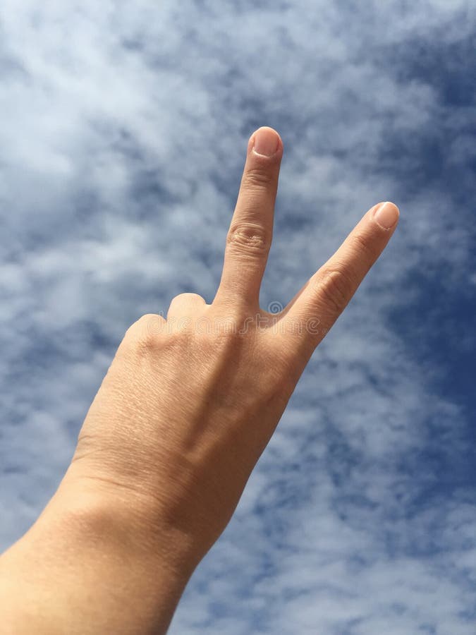 Making victory (V) sign stock photo. Image of grey, gray - 32552626