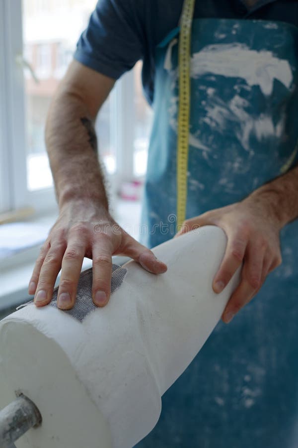 Hand of Male Specialist in Apron Processing Plaster Cast in Workshop Stock Image - Image of ...