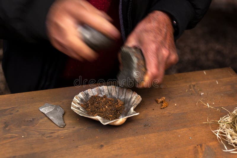 Hand of a Man in Action To Start a Fire Using Flint Stock Photo - Image ...