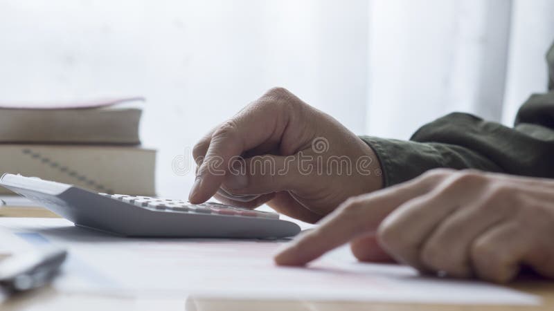 Hand of a Man Calculating Typing on a Calculator Stock Image - Image of ...