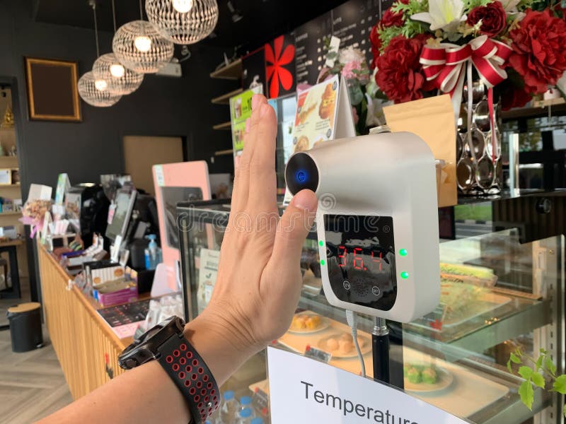 Hand of Man Checking Temperature before Entering Cafe with Digital ...