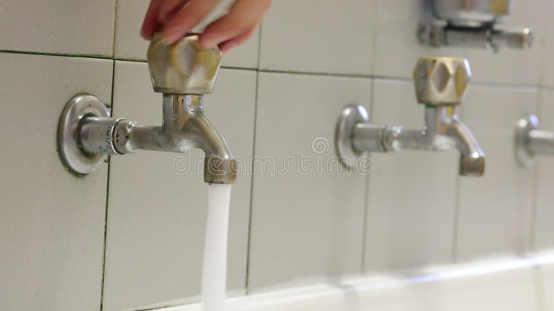 Hand Closing the Water Tap in the Sink To Avoid Waste Stock Footage ...