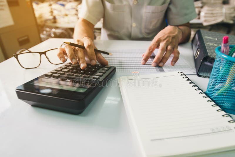 Hand Man Doing Finances and Calculate on Desk about Cost at Office ...